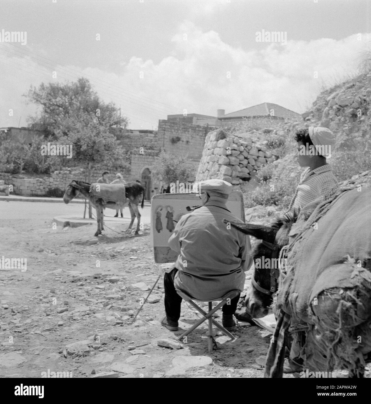 Artist on the street in Safad (Safed) busy capturing street freeles ...
