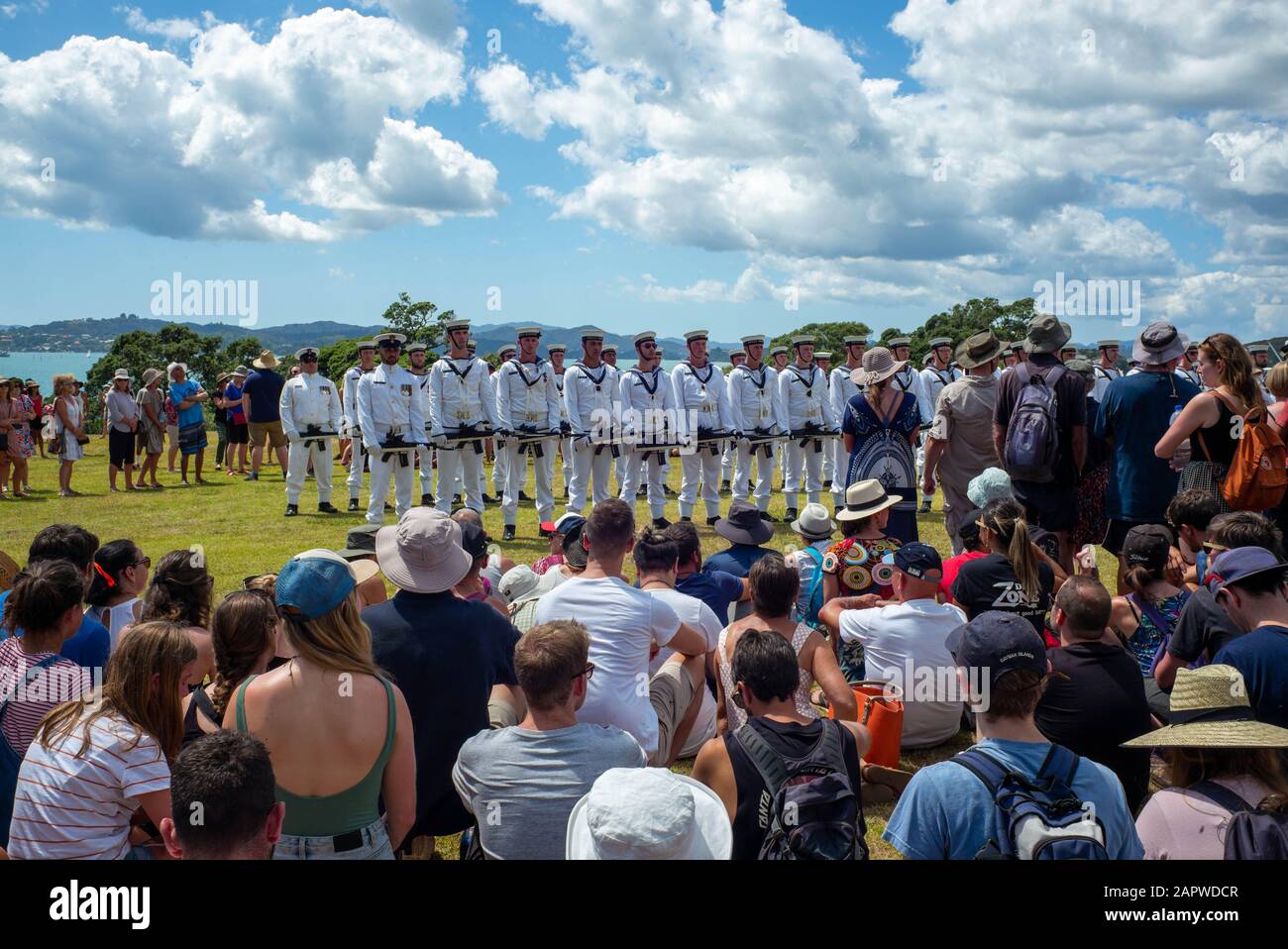 A crowd watches the New Zealand Royal Navy prepare for the gun salute ...