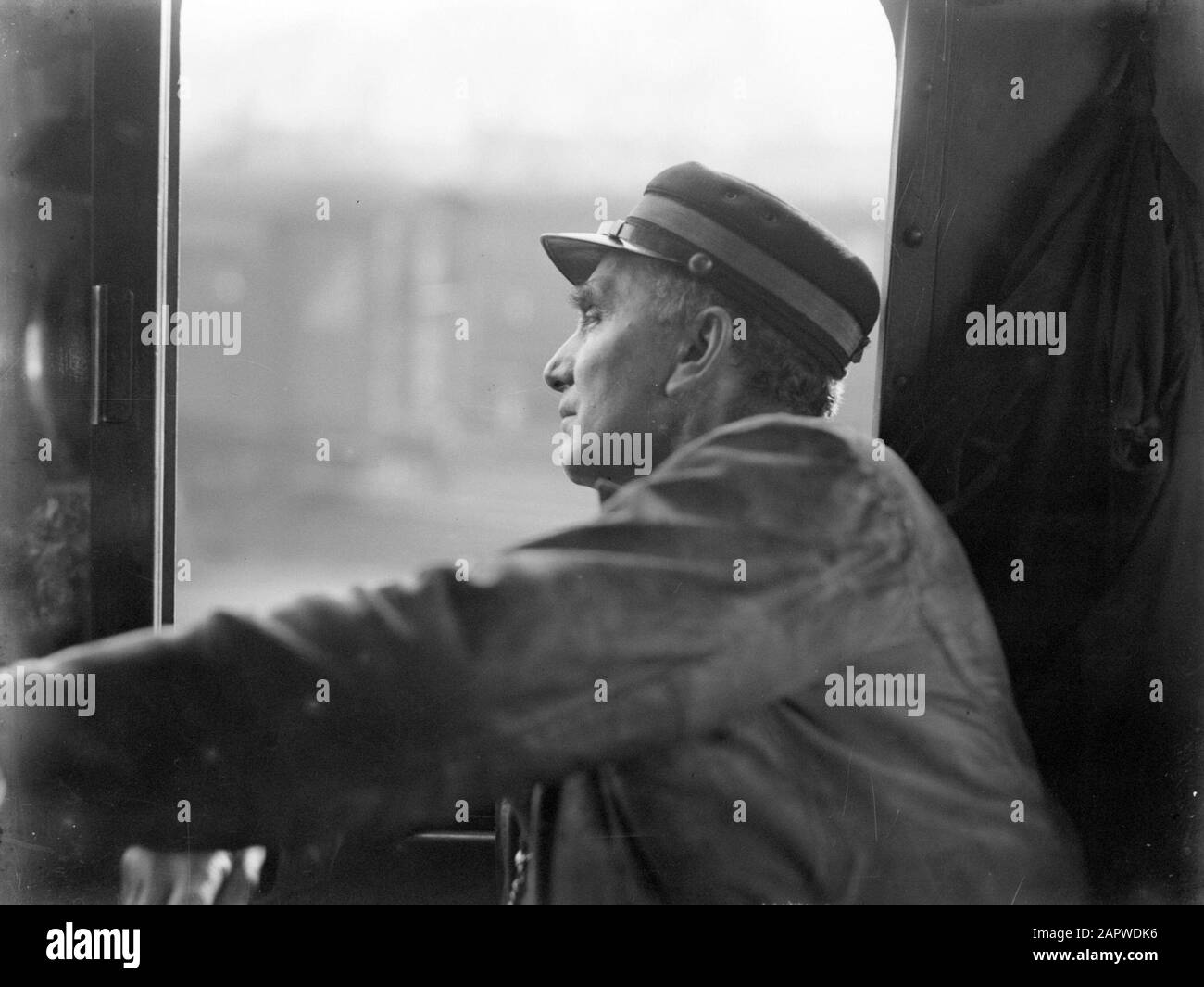 Reportage Nederlandse Railways Engineer looks out the side window of a ...