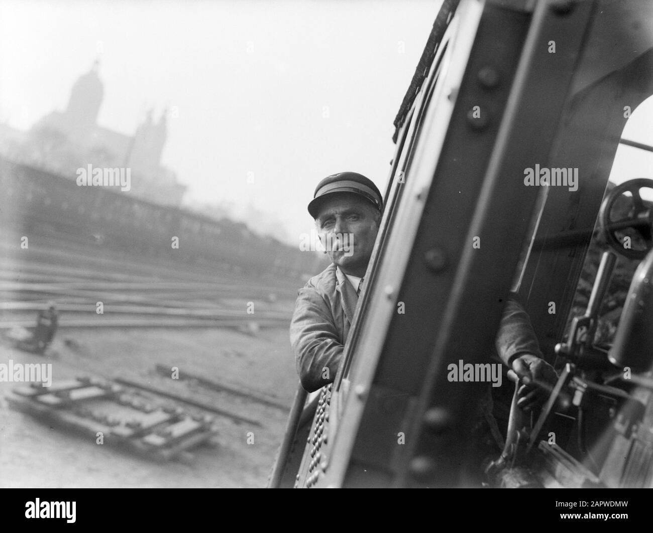 Reportage Nederlandse Spoorwegen Engineer looks out the side window of ...