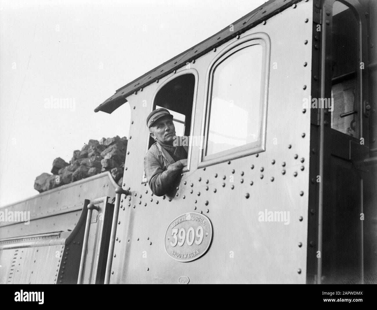 Reportage Nederlandse Railways Engineer looks out the side window of a ...