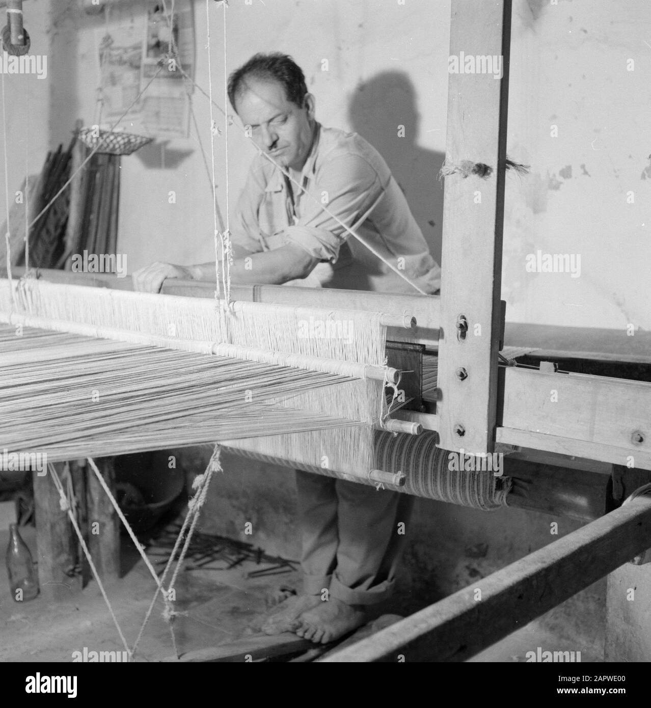 Man on a loom Date: January 1, 1964 Location: Israel Keywords: workers ...