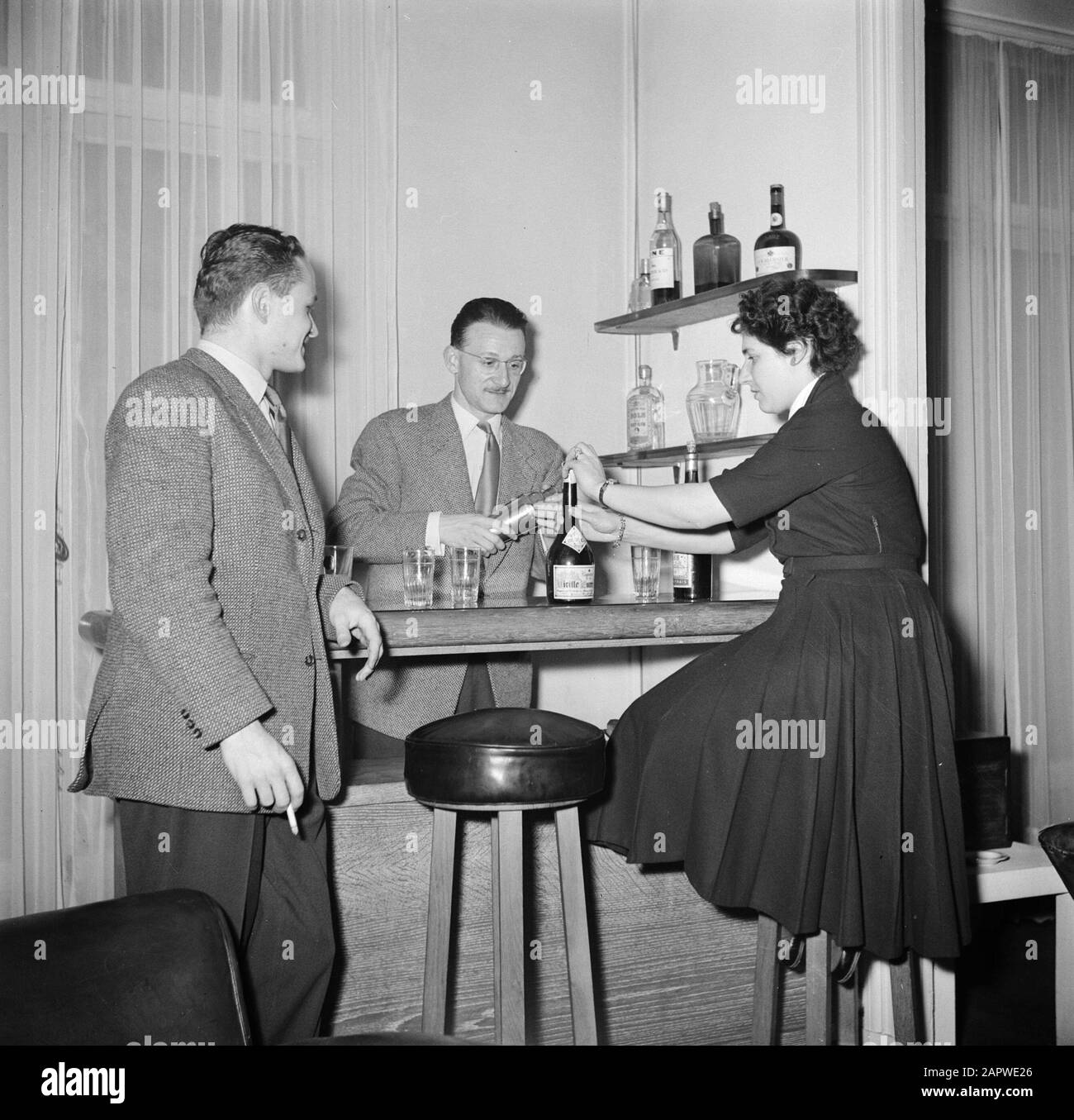 Residents of an apartment building in Paris Man prepares cocktails in ...