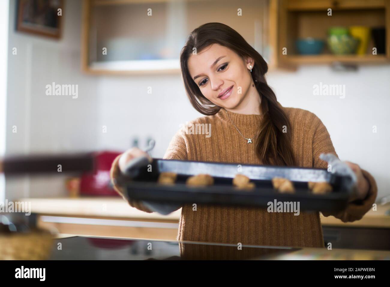 Young woman baking cookies in hi-res stock photography and images - Alamy