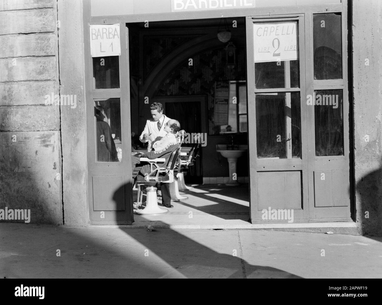 Rome: Visit to the city Man shaved by a barber while two men watch in ...