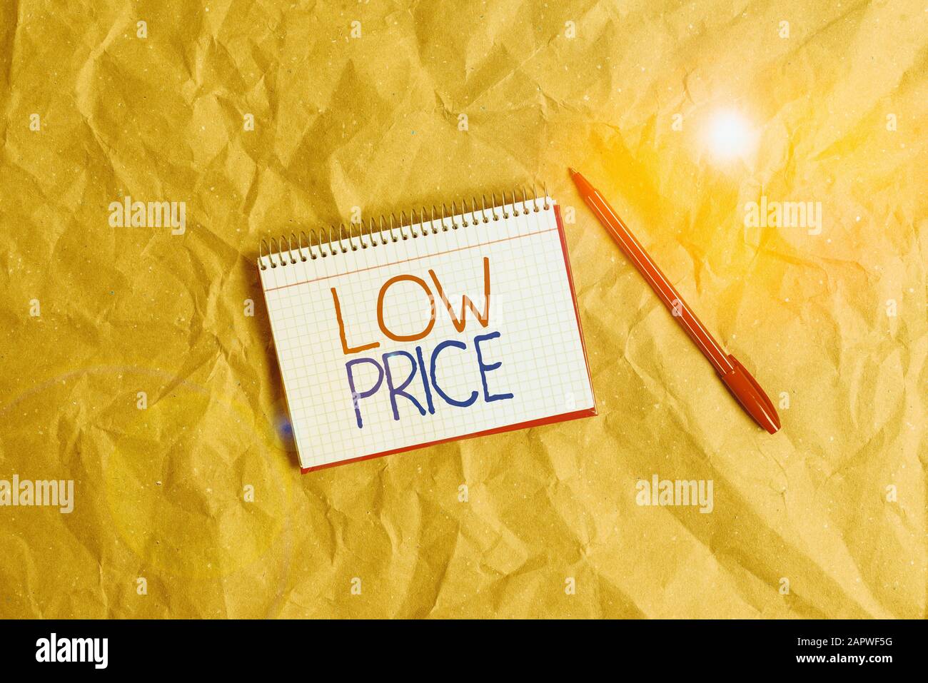 Writing note showing Low Price. Business concept for Price are the ...