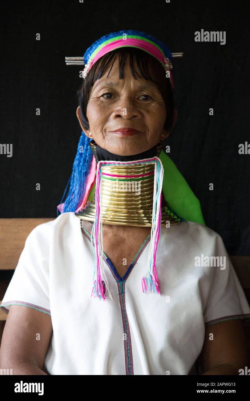 One woman from the long neck tribe with black background, Inle Lake ...