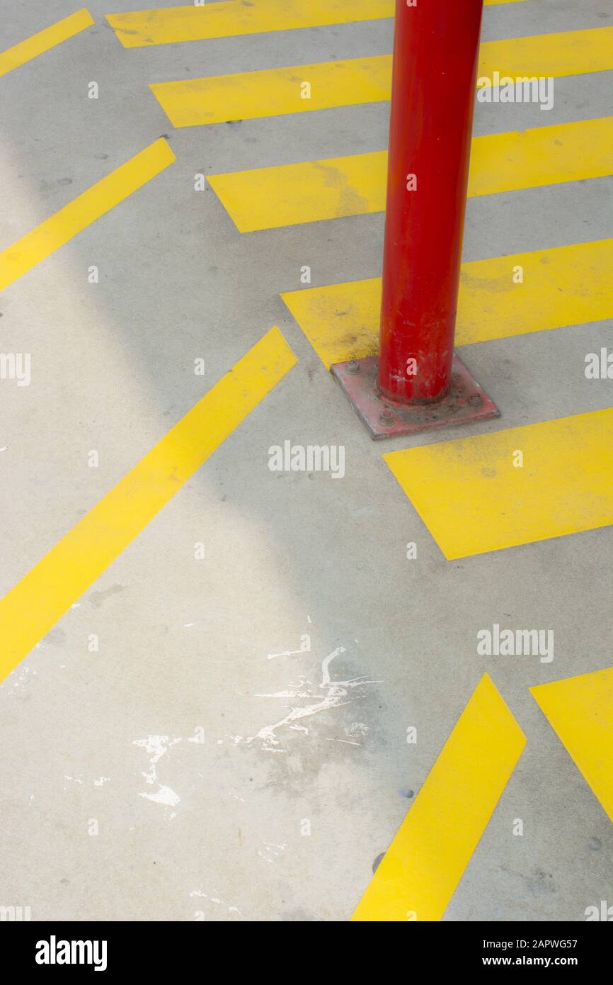 Red street pole near a zebra sign during daytime Stock Photo - Alamy