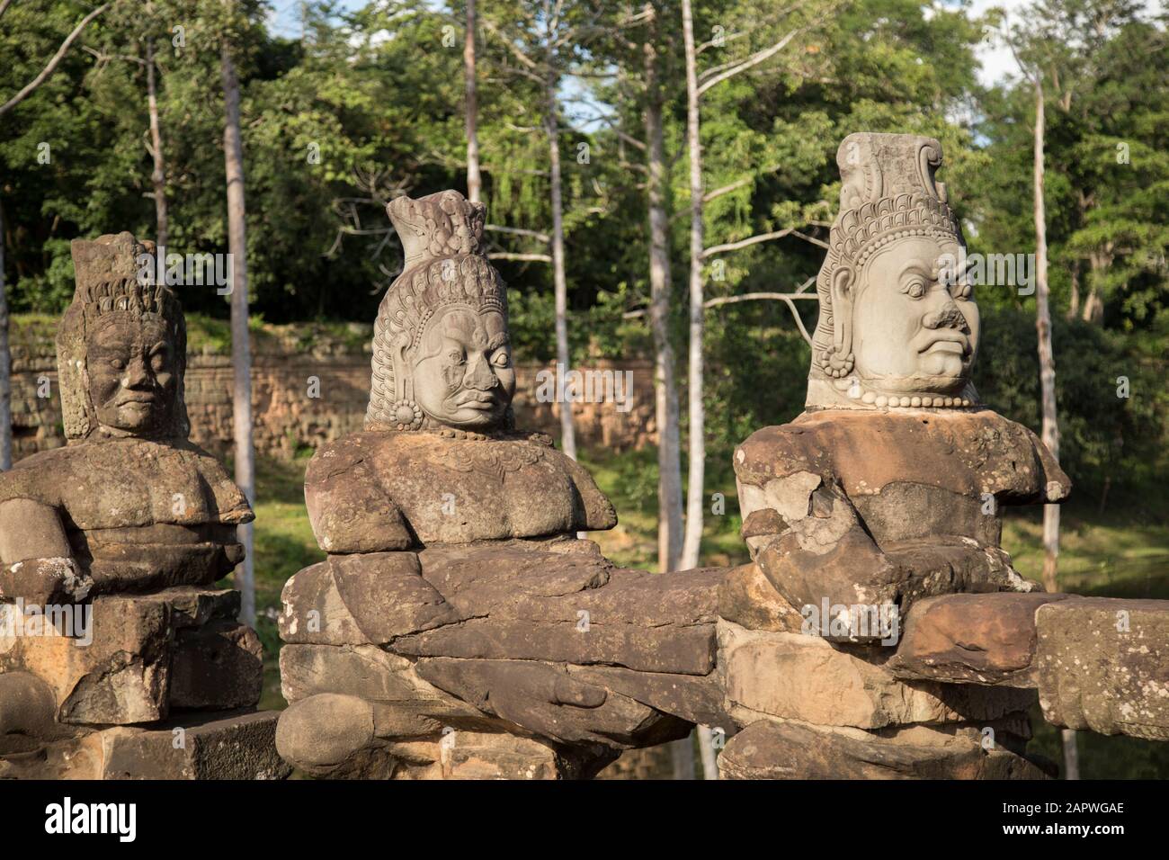 Three rock warrior statues on bridge located in Angkor Stock Photo - Alamy