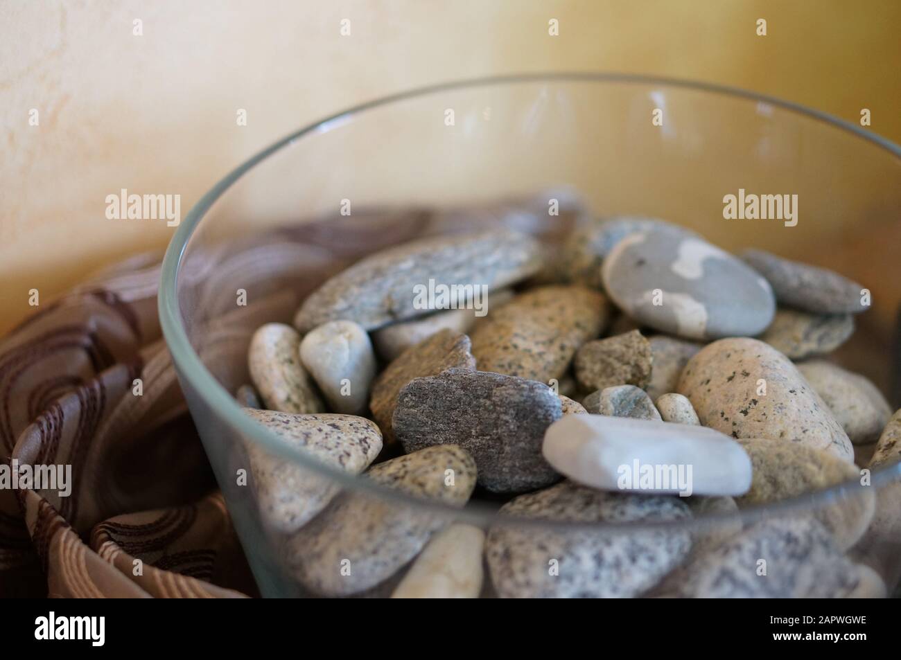 Selective focus shot of different sizes of rocks in a glass bowl Stock ...