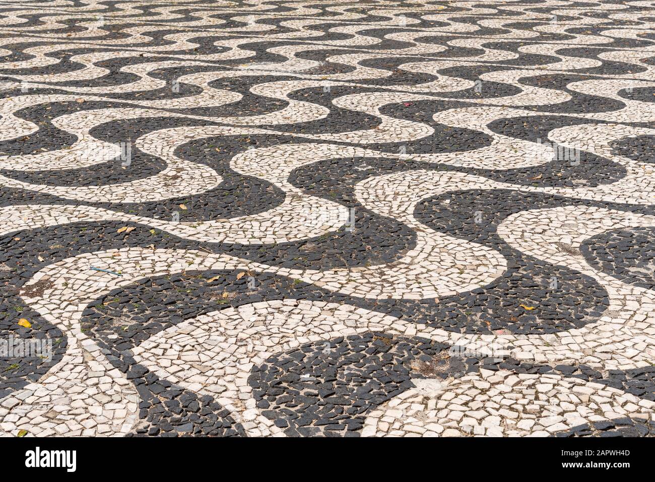 View to black and white wavy pattern with portuguese stones on central ...