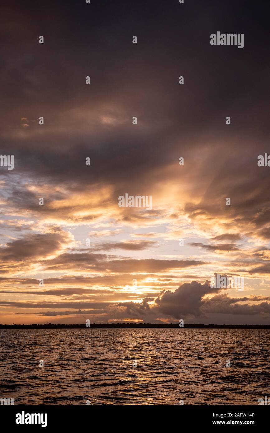 Beautiful Amazon sunset over the waters of Negro River with colorful ...