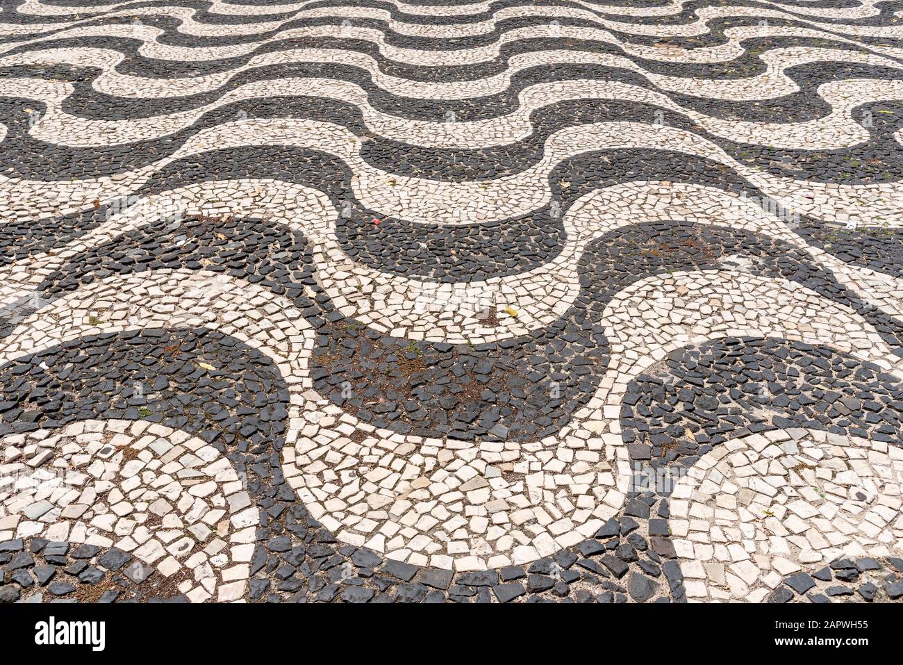 View to black and white wavy pattern with portuguese stones on central ...