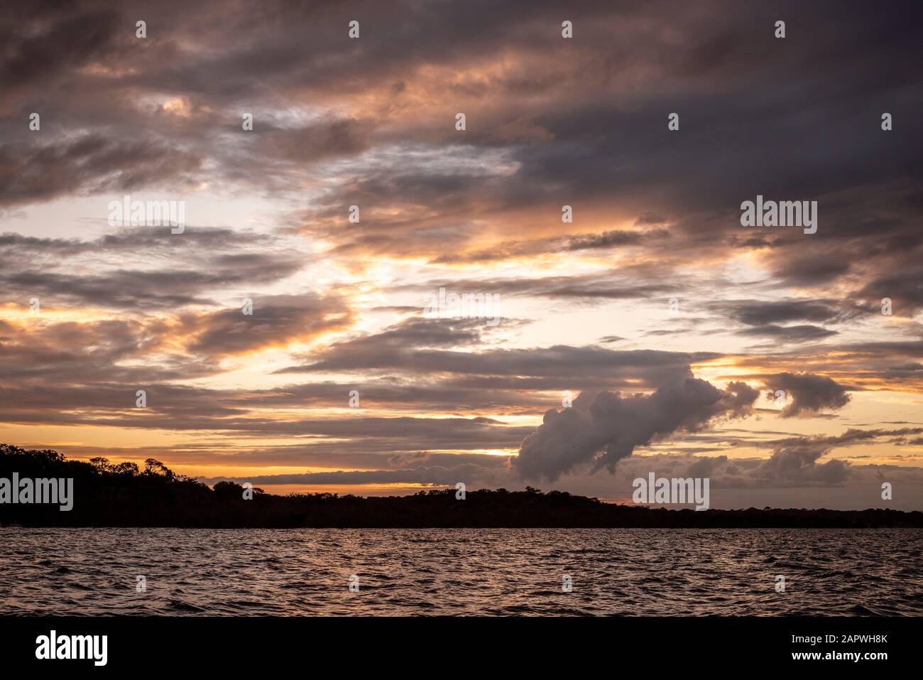 Beautiful Amazon sunset over the waters of Negro River with colorful ...
