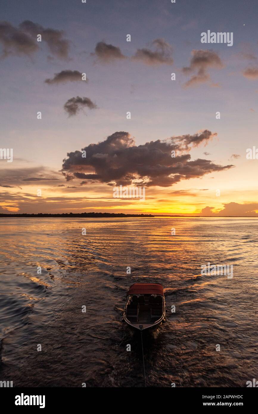Beautiful Amazon sunset over the waters of Negro River with colorful ...