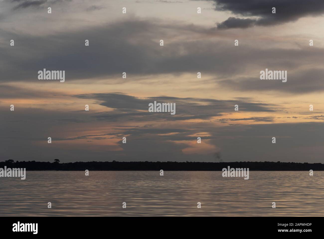 Beautiful Amazon sunset over the waters of Negro River with colorful ...