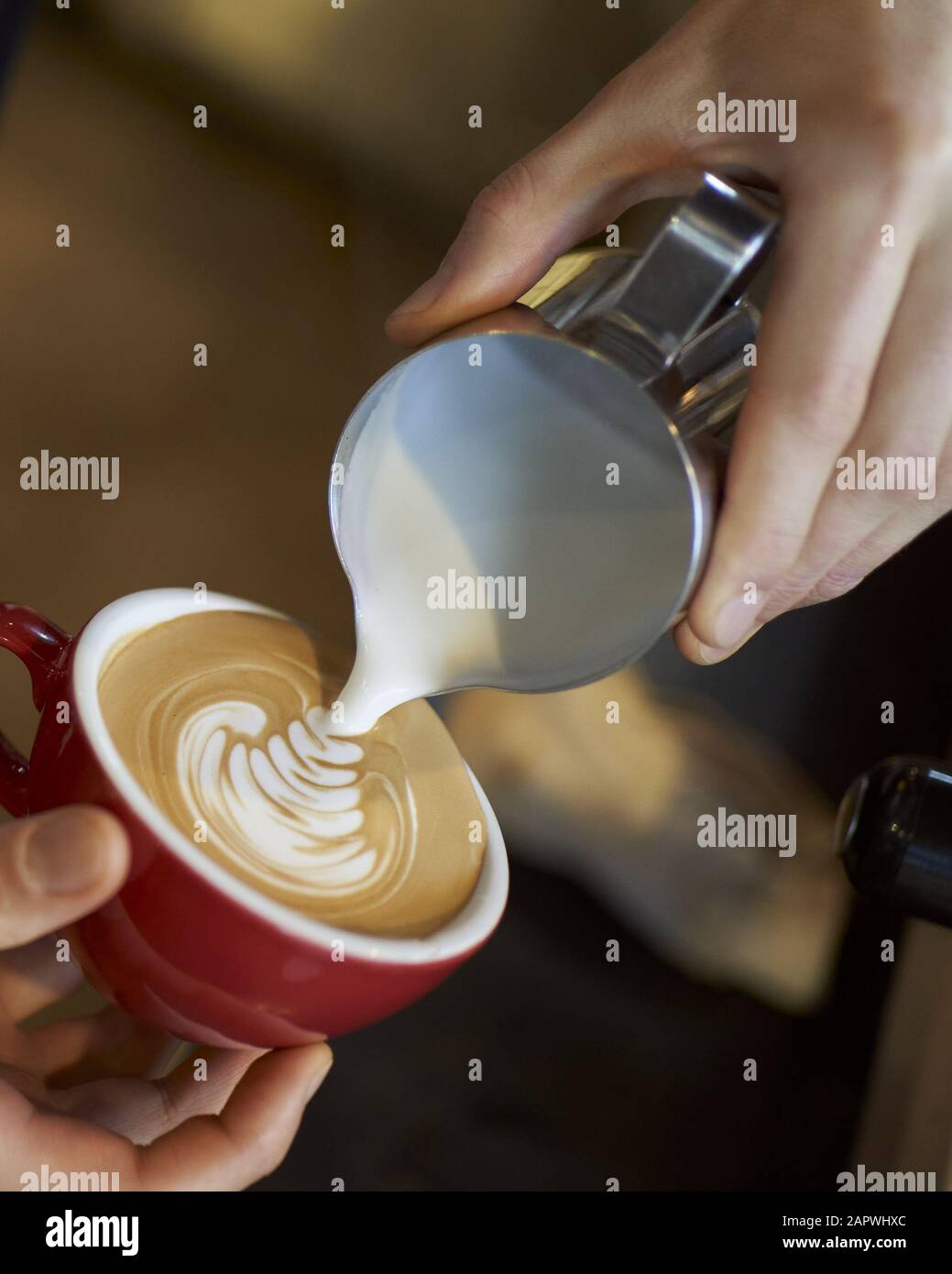 Vertical shot person pouring cream hi-res stock photography and images ...