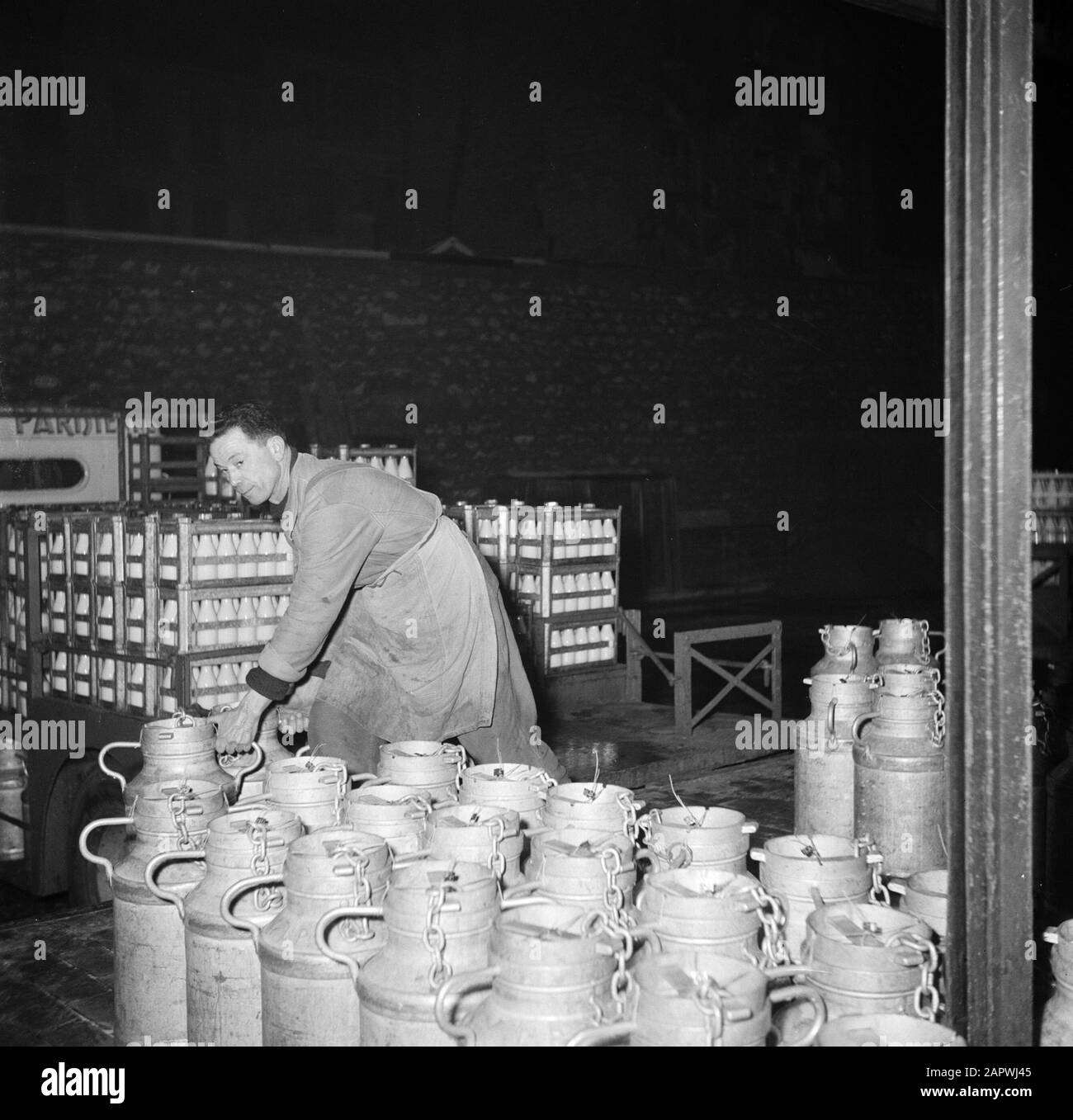 Reportage Paris Milk factory: man dragged the milkcans Date: 1950 ...