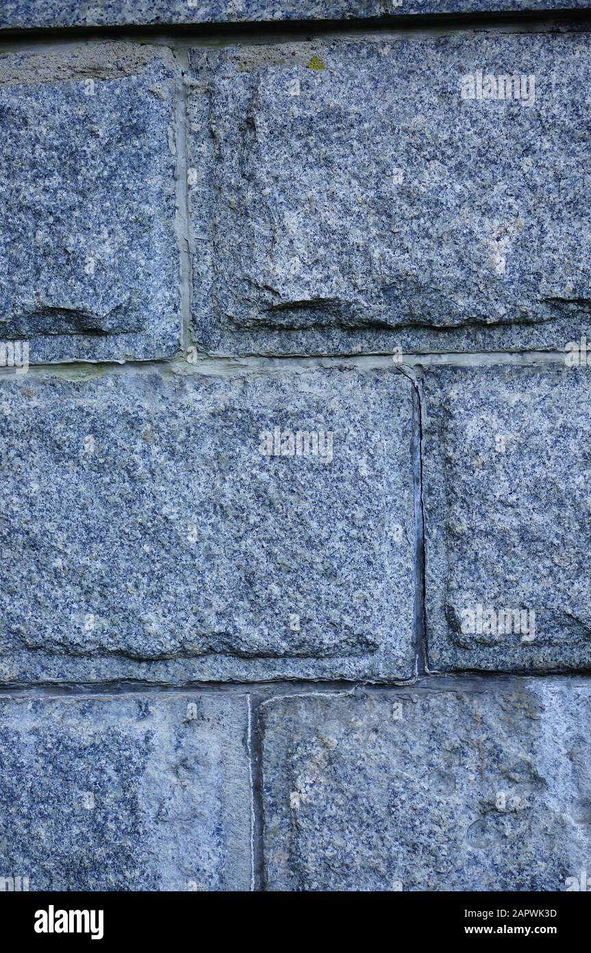Vertical closeup shot of a grey brick wall with rectangular tiles Stock ...
