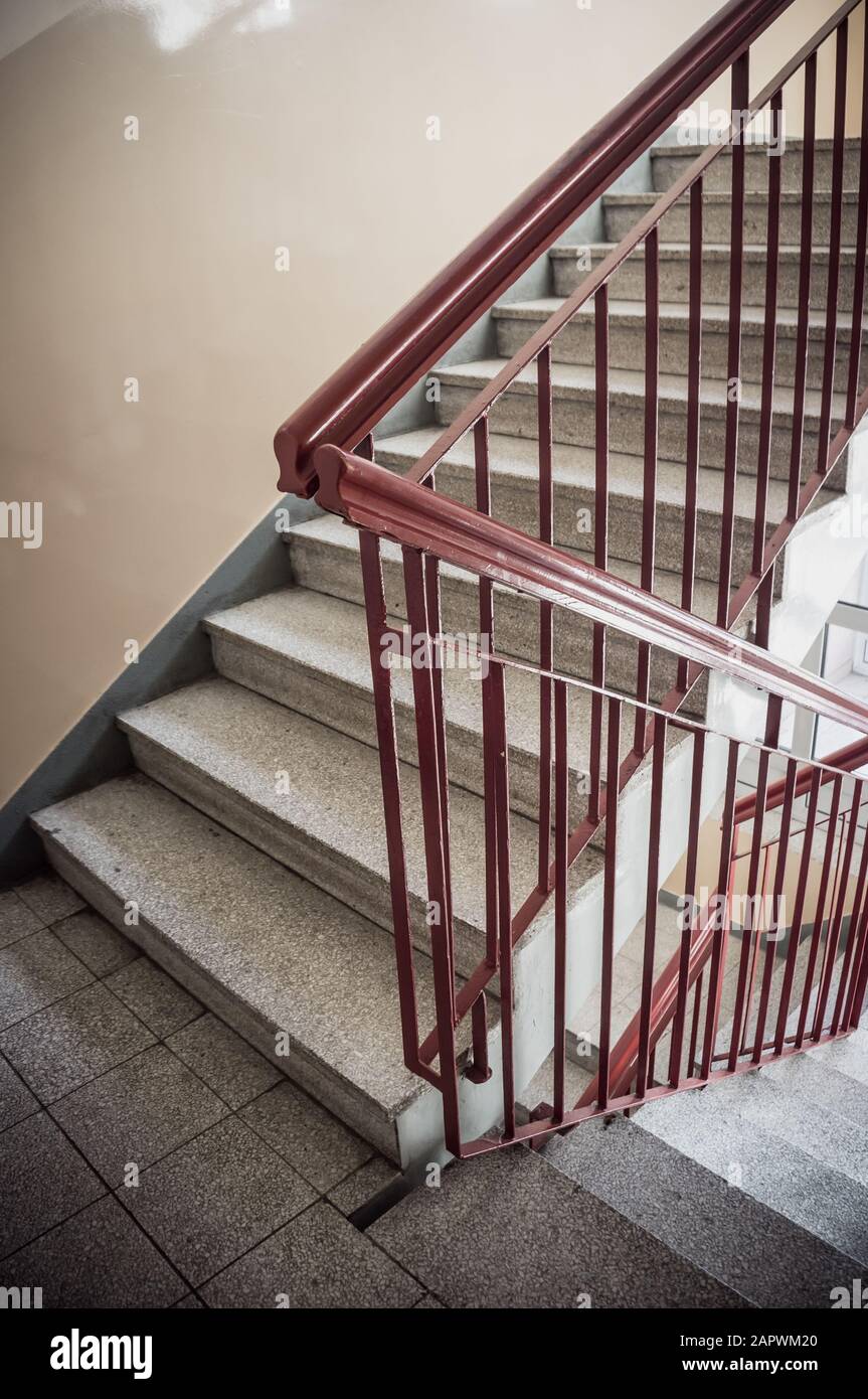 Vertical shot of a staircase with metal railings Stock Photo - Alamy