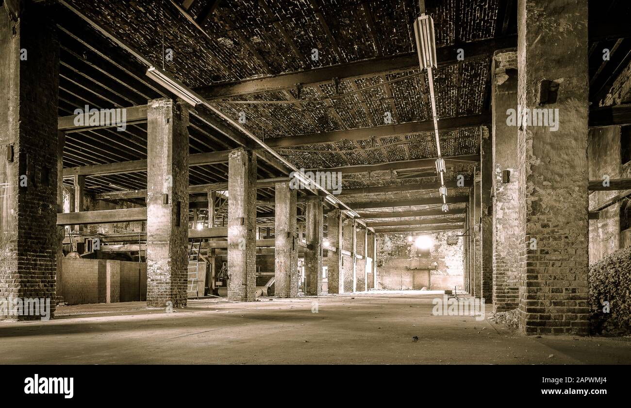 Inside of an old abandoned former industrial stone building Stock Photo ...