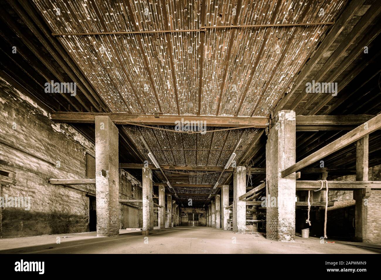 Inside of an old abandoned former industrial stone building Stock Photo ...