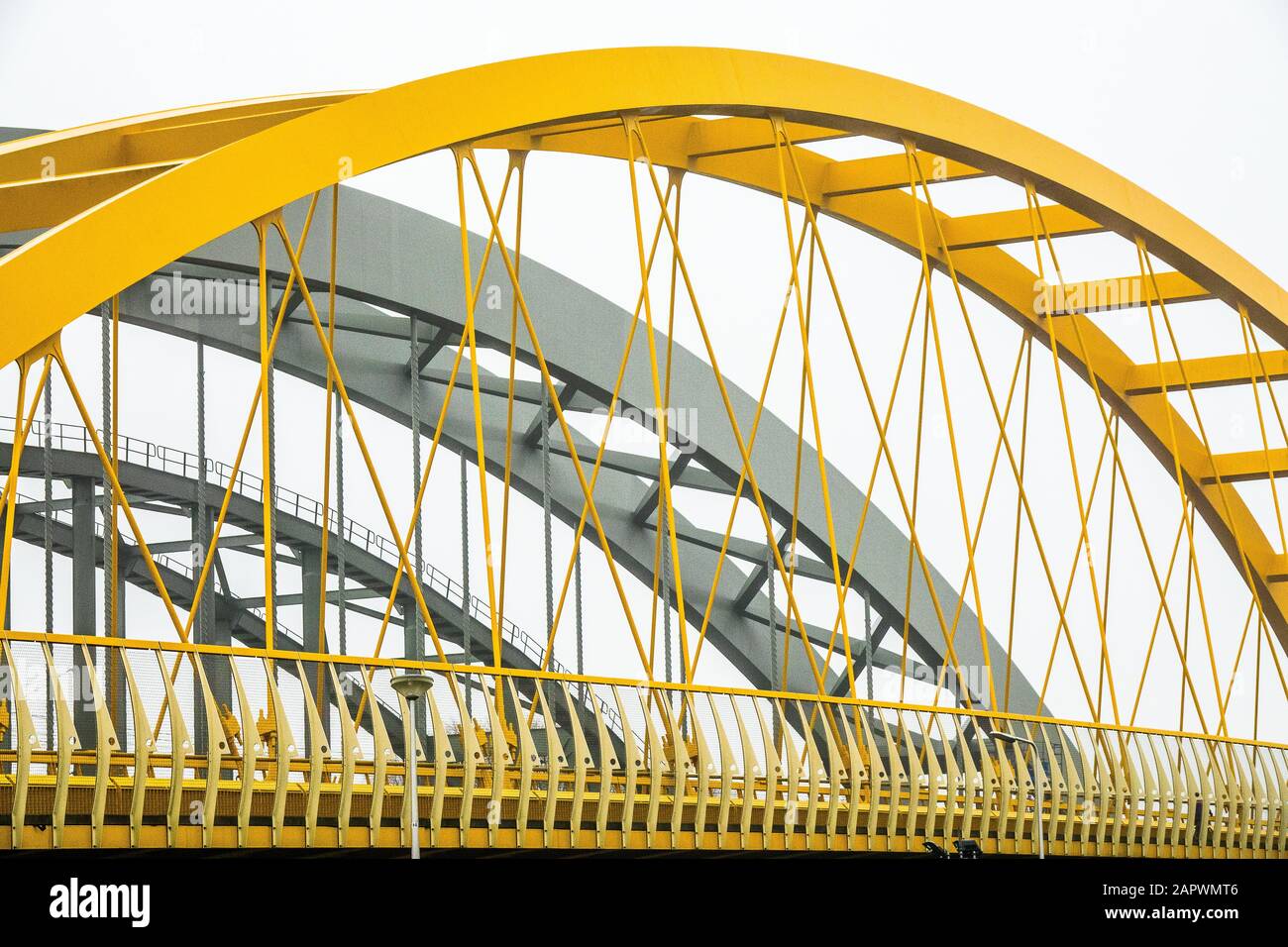 Modern bridge with yellow and grey fragments on a white background ...