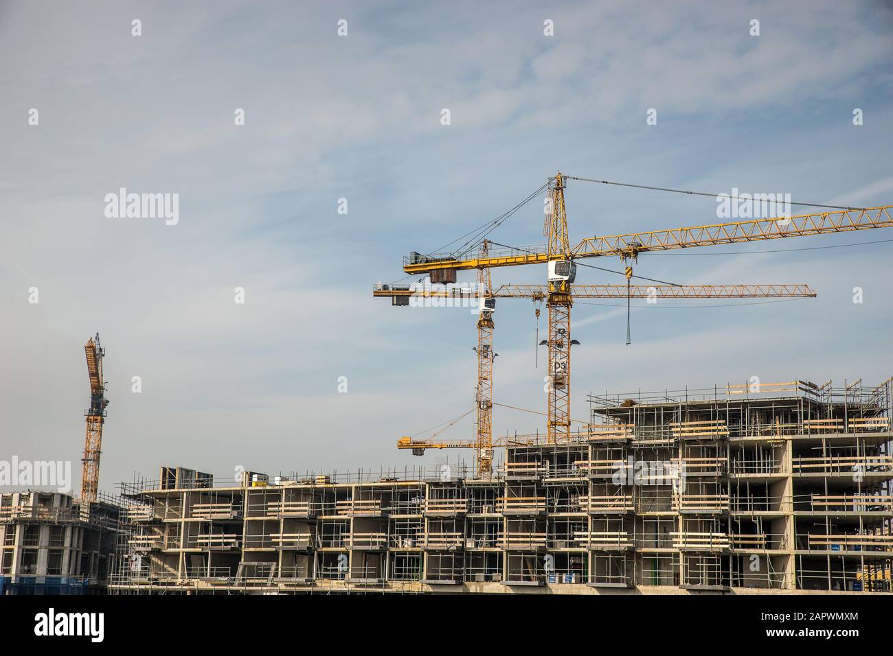 New buildings being constructed in a suburban area with the help of the ...