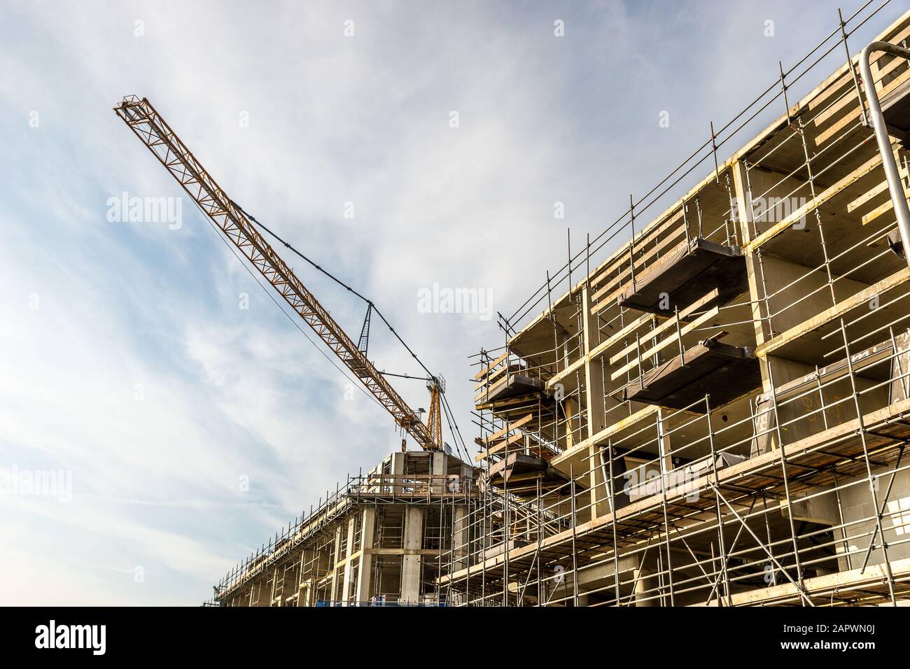 New buildings being constructed in a suburban area with the help of the ...