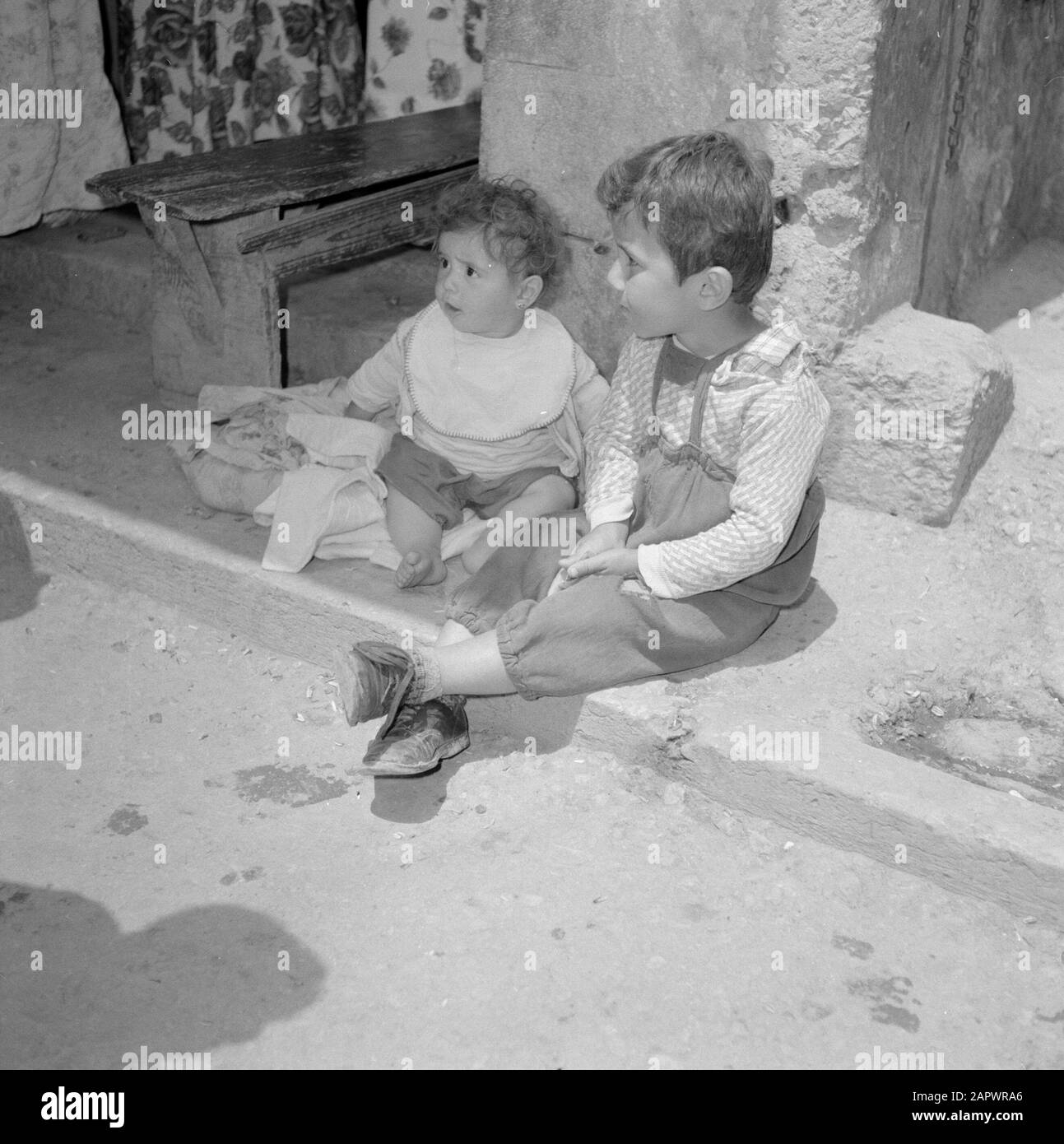 Israel: Nazareth Nazareth. Portrait of two young children sitting on a ...