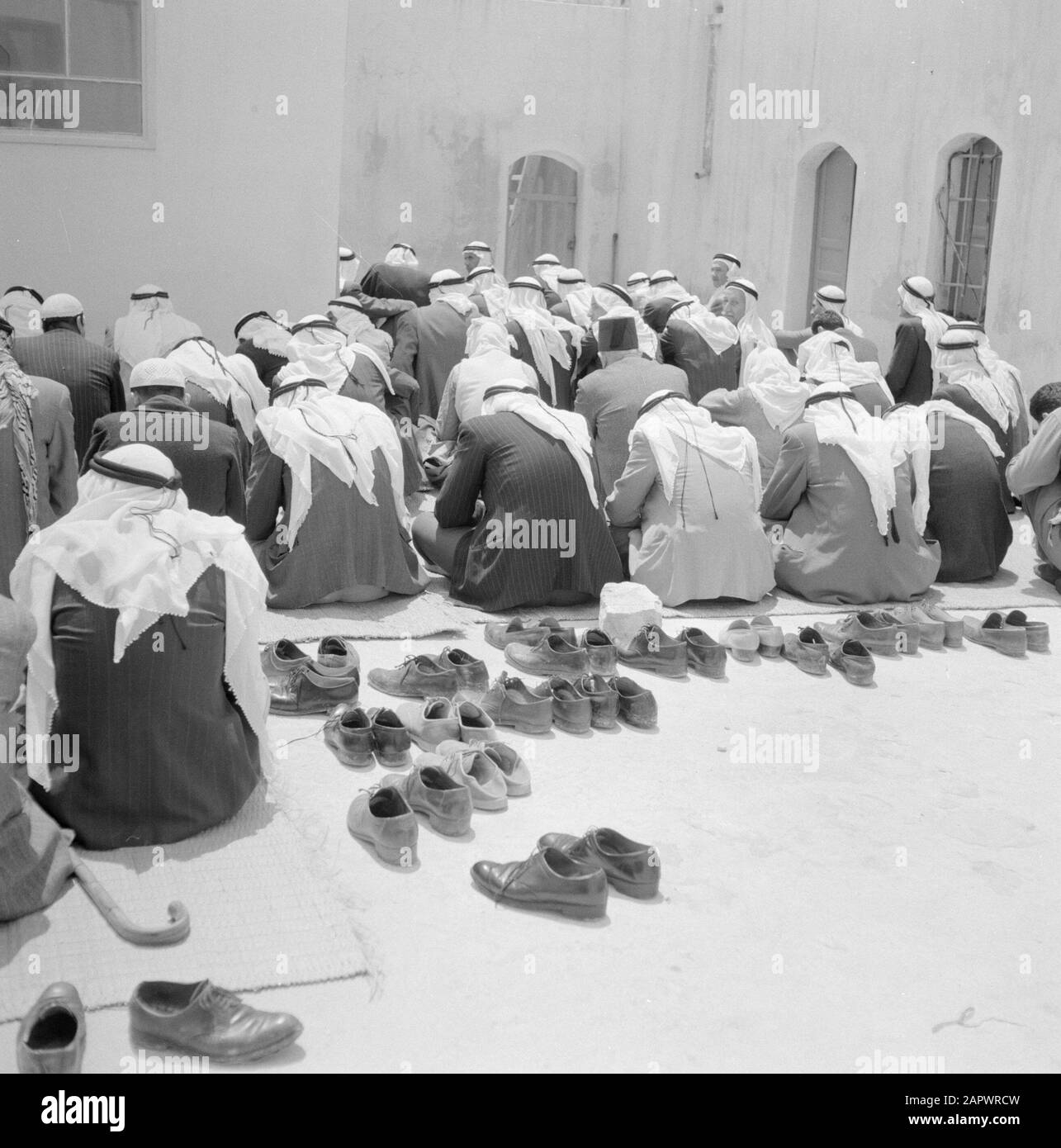 Israel: Nazareth Nazareth. Praying Muslim men near a building ...