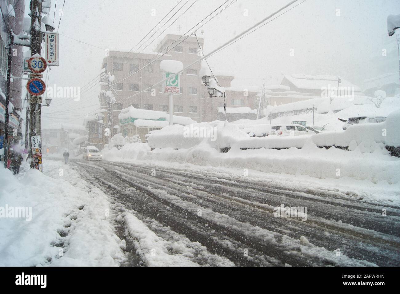 Snow continues to fall on the snowy, slushy main Onsen Gai (hot spring ...