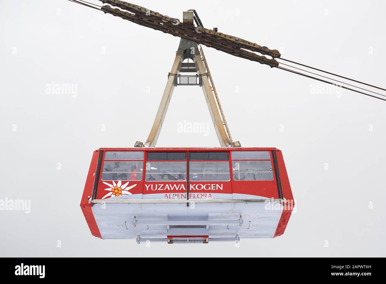 A red cable car (aerial tramway, sky tram, ropeway or aerial tram ...