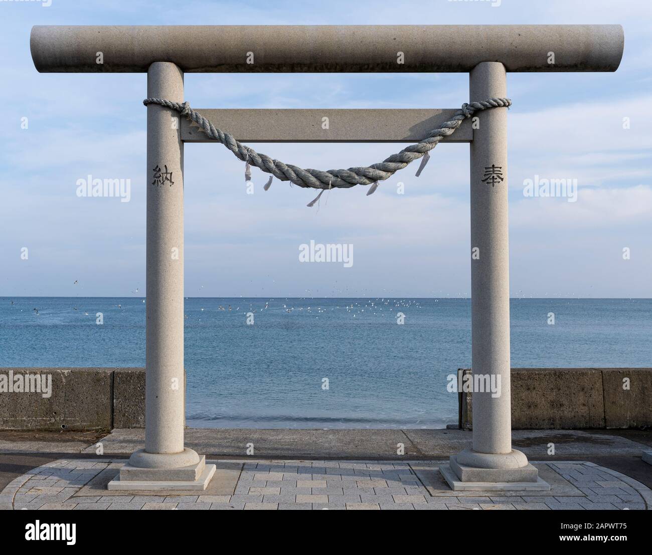 A stone torii gate on the coast at Kinokai in Hokkaido, Japan Stock ...