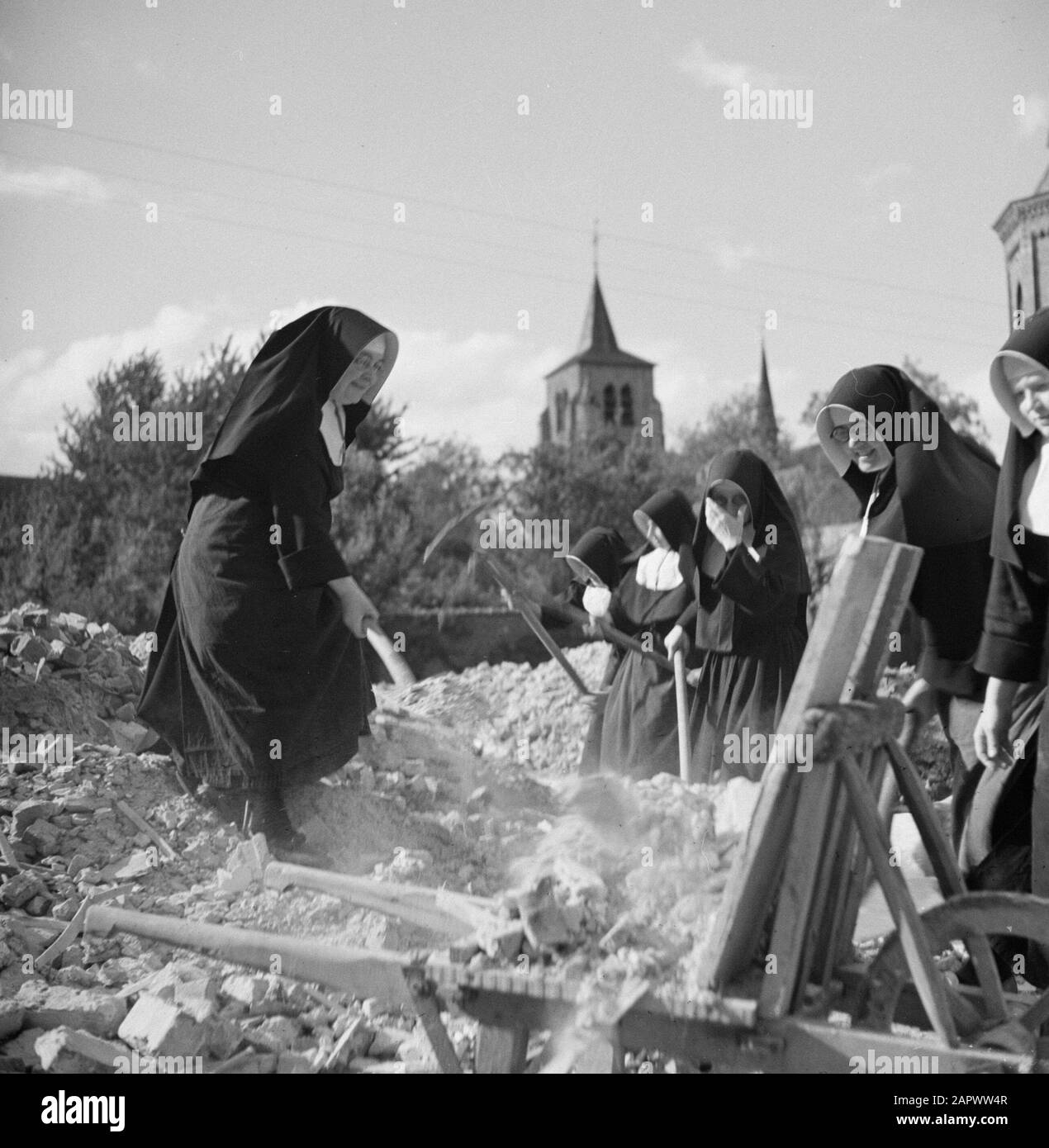 Rebuilding of a nunnery Nuns clearing debris Date: 1940 Location ...