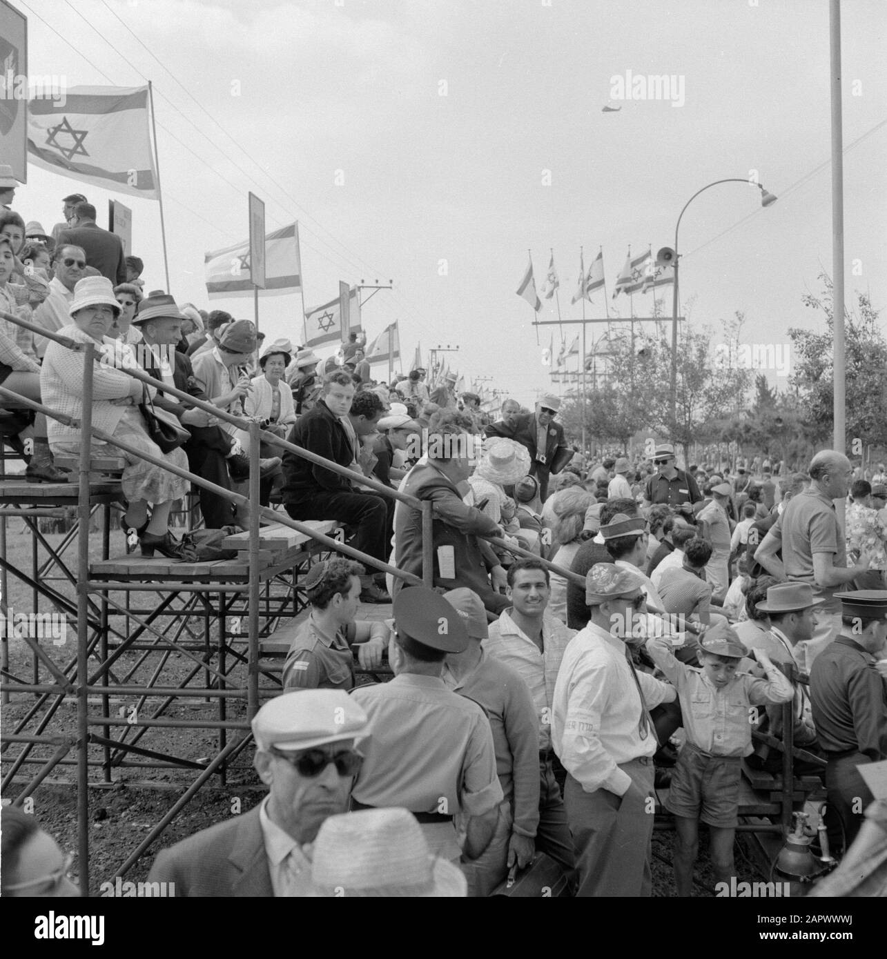 Independence Day (May 15). Audience in a grandstand with flag masts ...