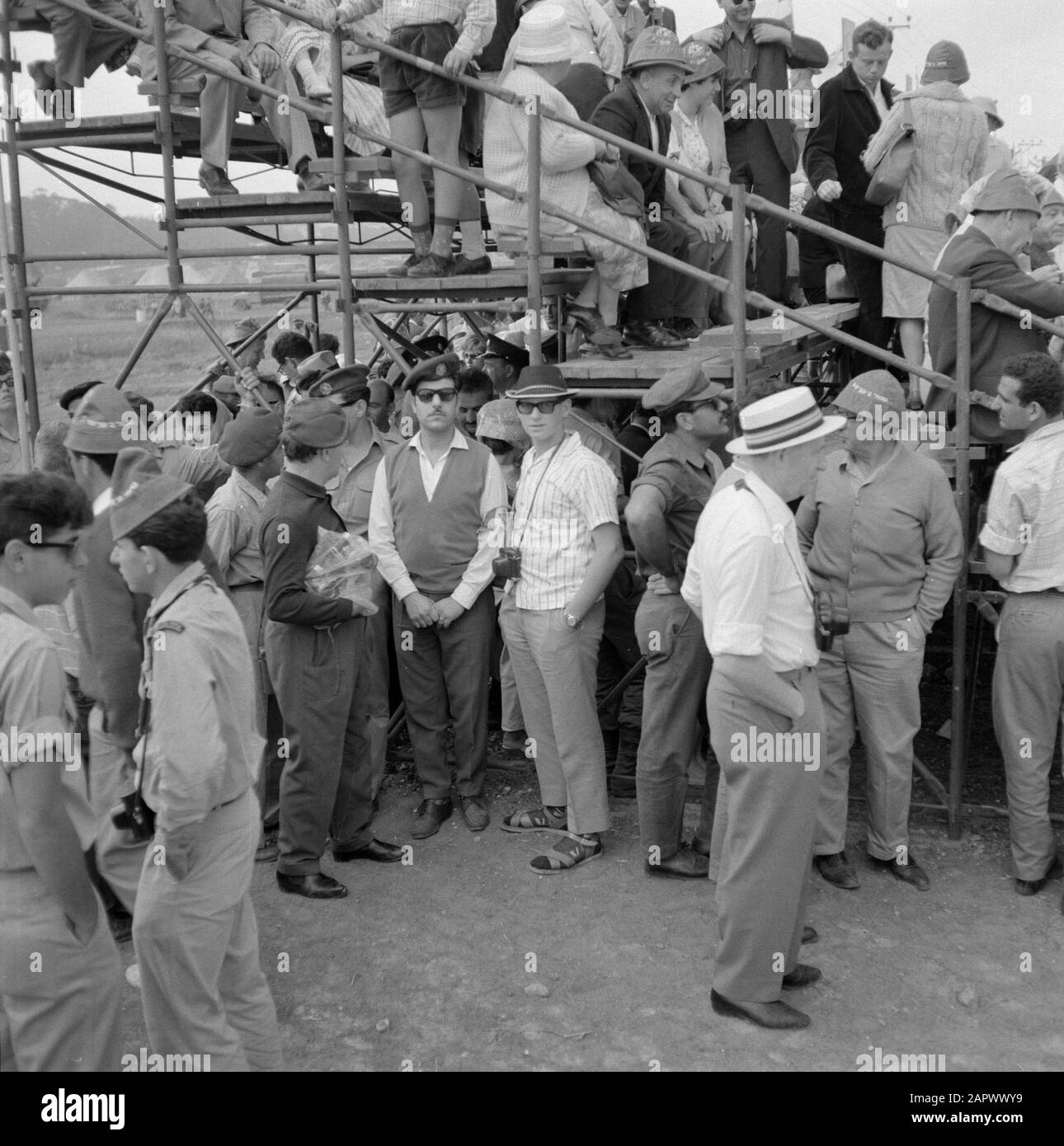 Independence Day (May 15). Audience in a grandstand with flag masts ...