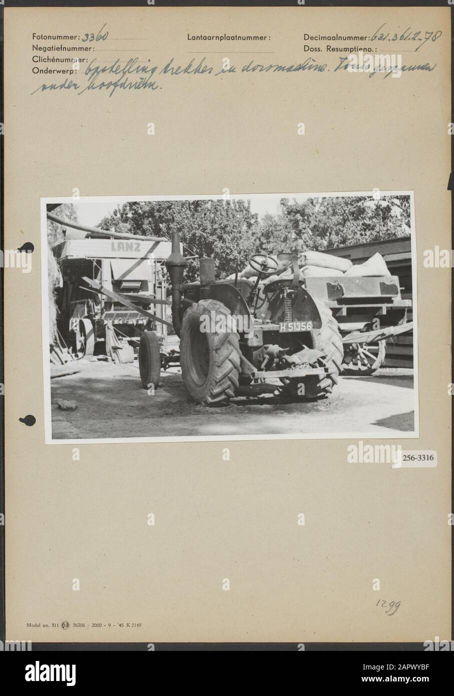 Agricultural tools Drawler and threshingmachine. with a rope stretched ...