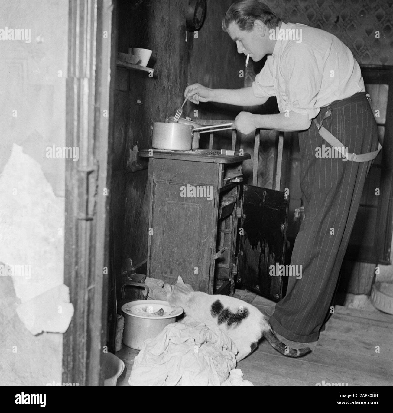 Spivs in Soho, London Paddy cooks on a stove Annotation: Spiv is the ...