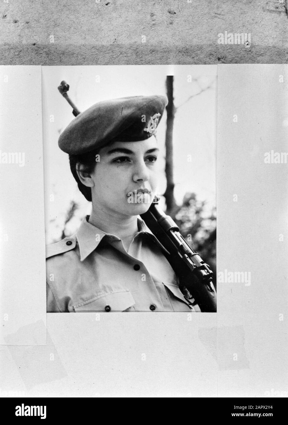 Portrait of an Israeli female soldier with the gun over the shoulder ...