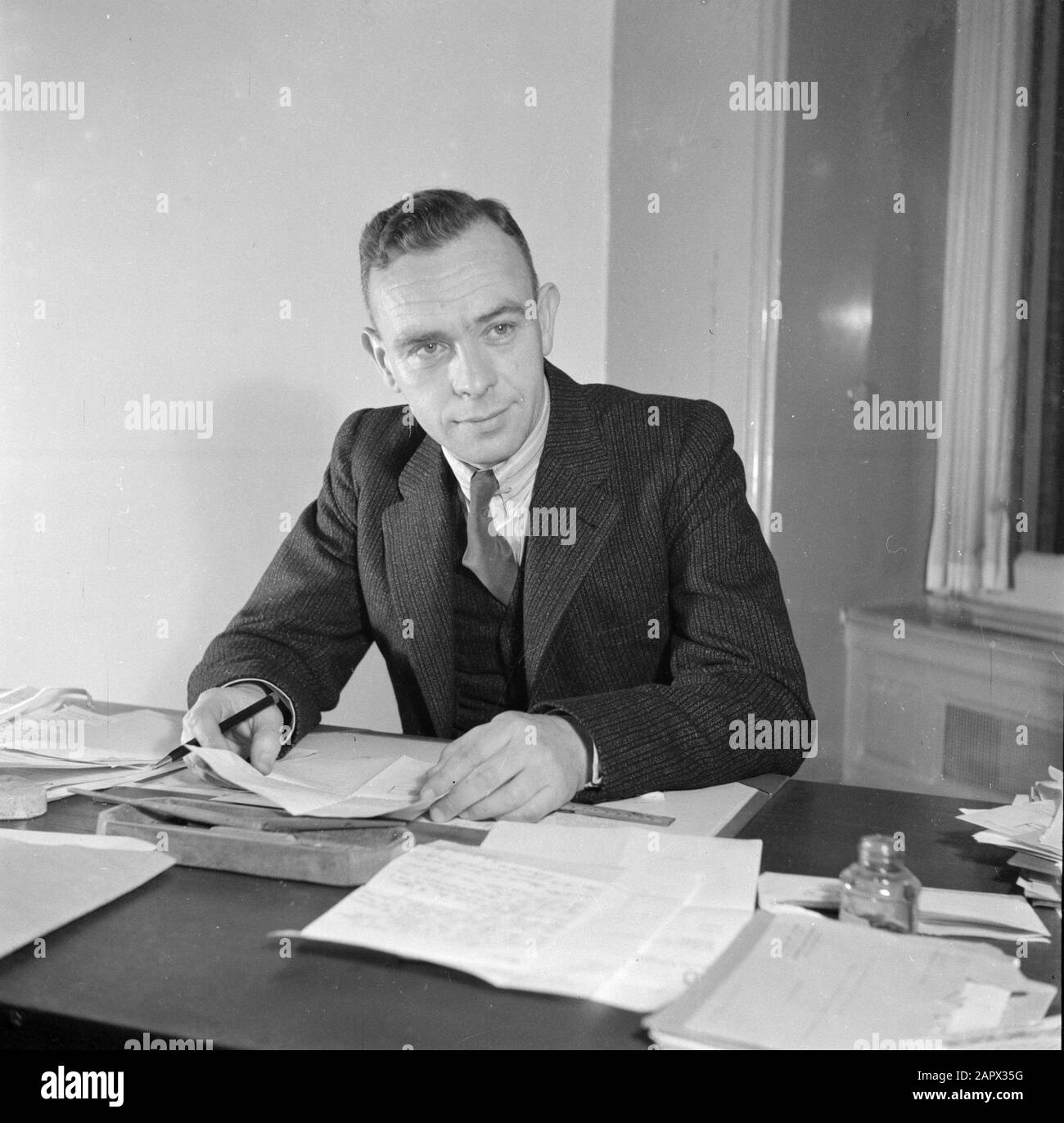 Portrait of an unknown politician behind his writing desk Date: undated ...