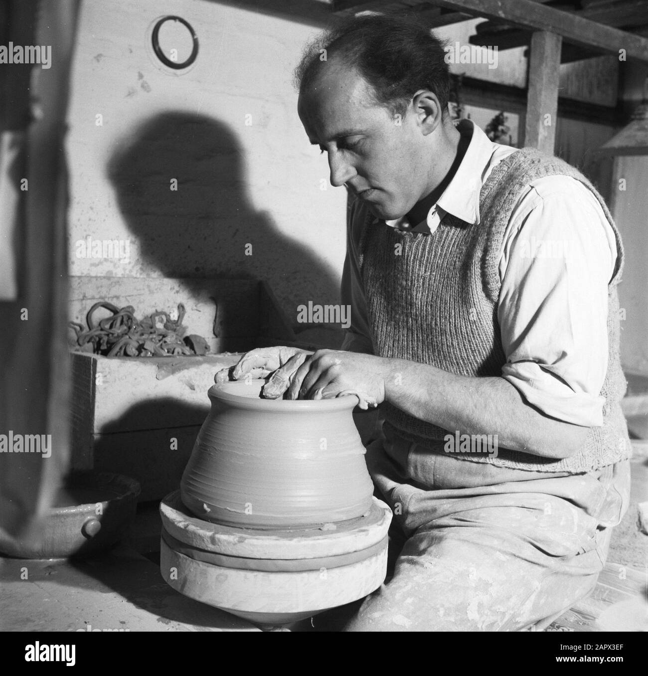 Pottery Saxbo Potter at work on the shovel chair Date: March 1954 ...