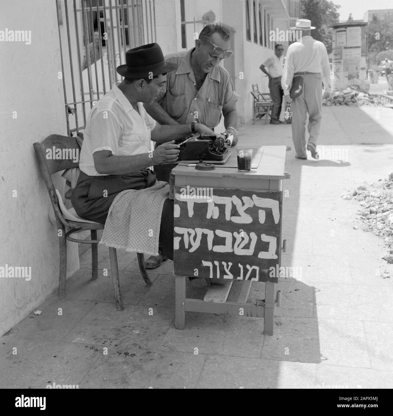 Israel 1964-1965: Tel Aviv, public writers Public writers sit with a ...