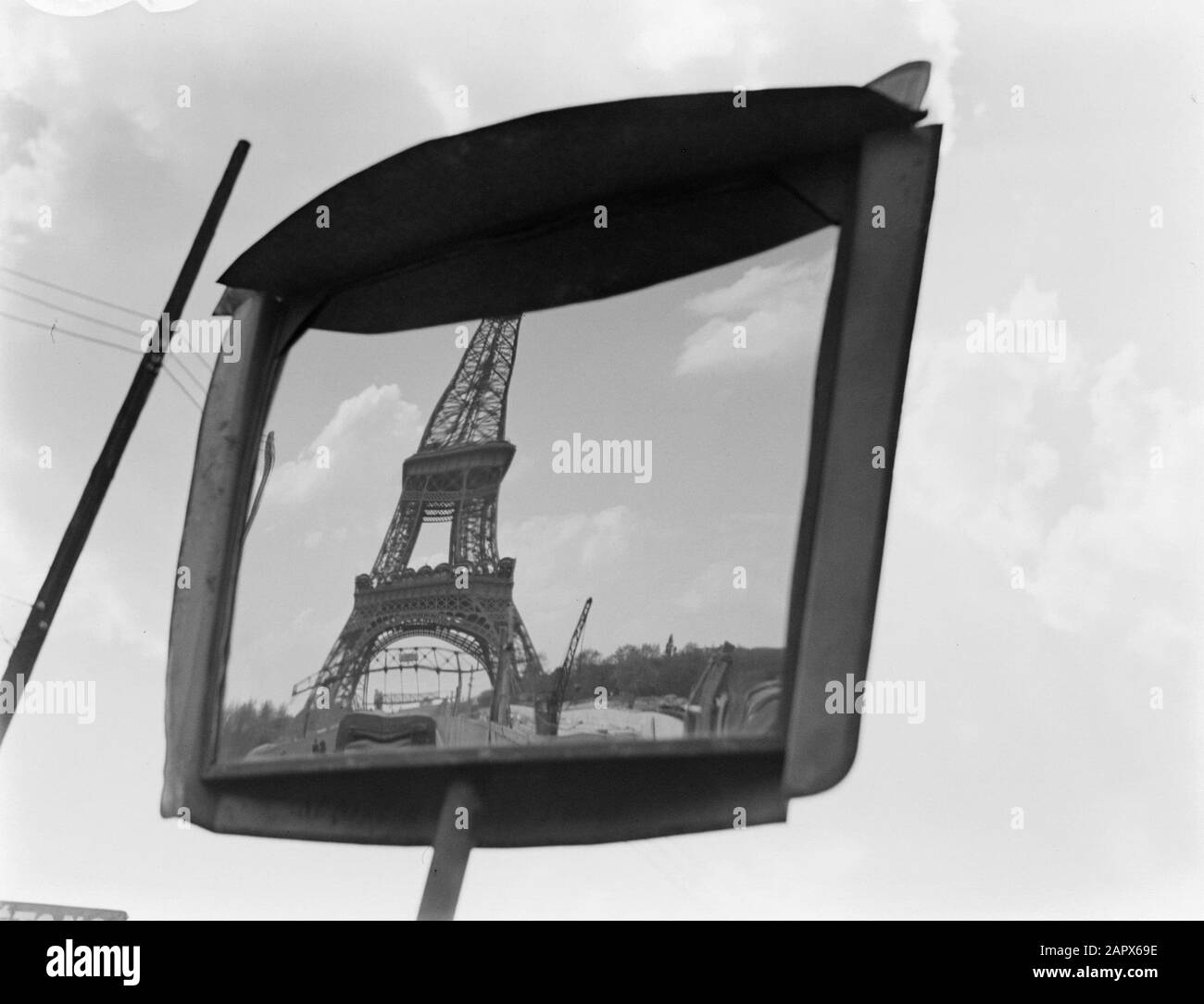 Reportage Paris Reflection of the Eiffel Tower in a mirror Date: 1936 ...