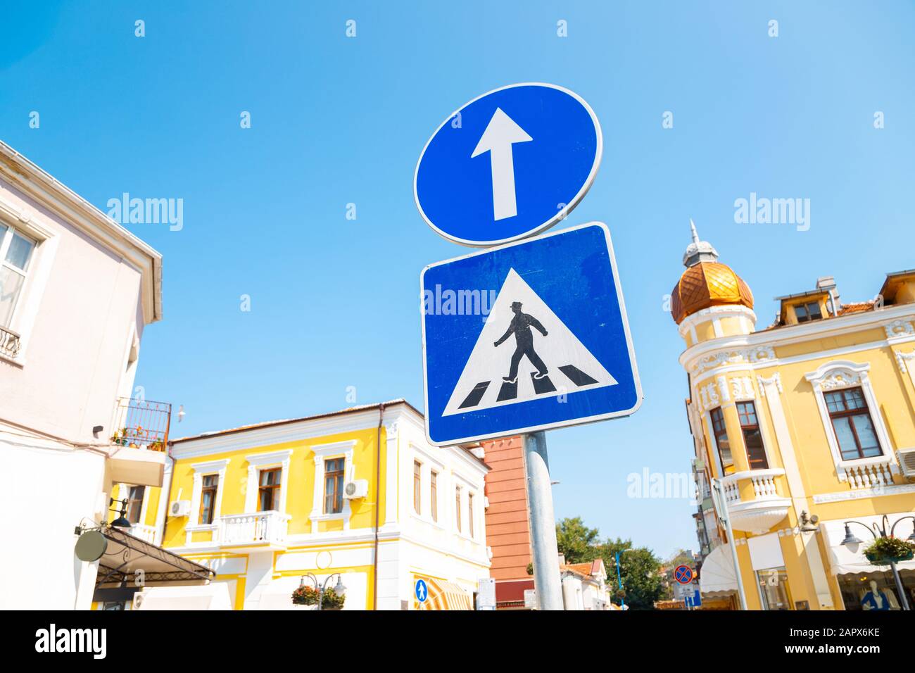 Traffic sign pedestrian crossing in European old town Stock Photo - Alamy
