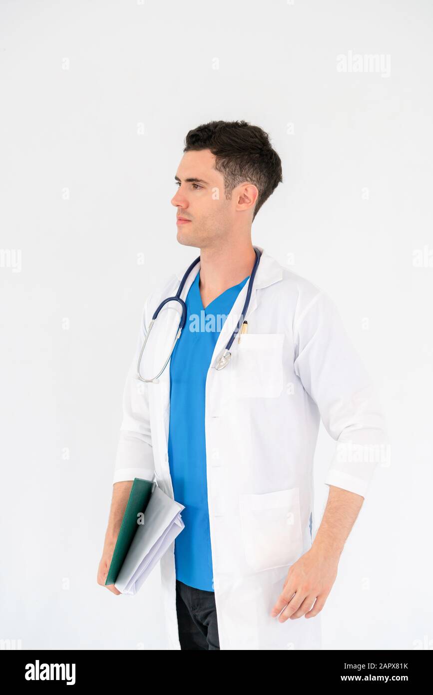 Confident handsome male doctor wearing hospital uniform on white ...