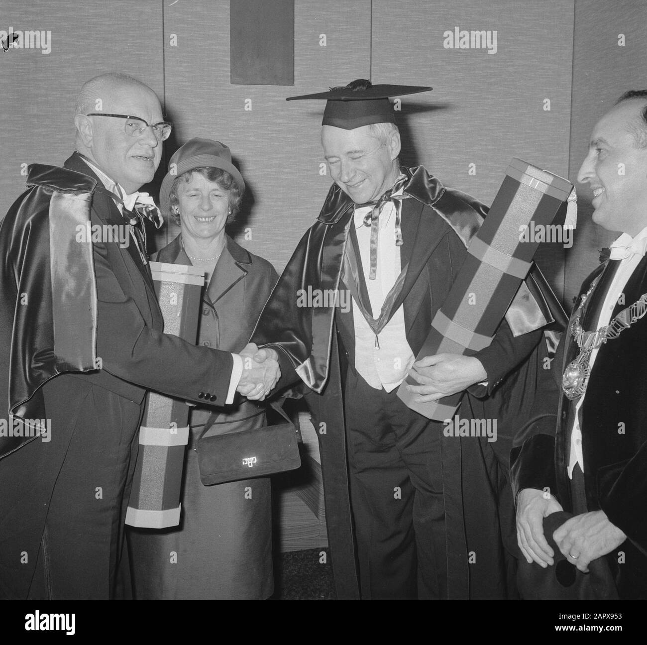Carl Romme (left) and Colin Clark (eyes closed) receive honorary ...