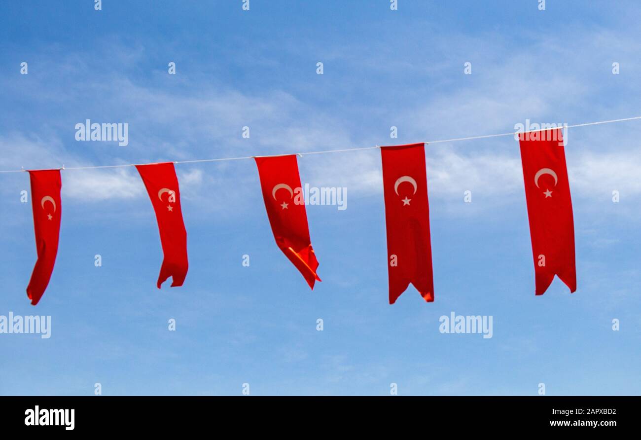 Turkish national flags with white star and moon in sky Stock Photo - Alamy