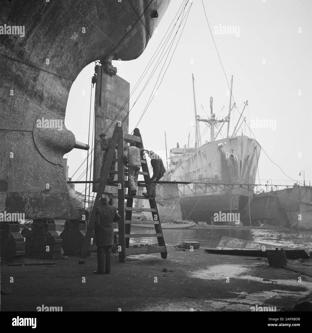 Ship repair yard. Workers engaged at screw Date: undated Keywords ...