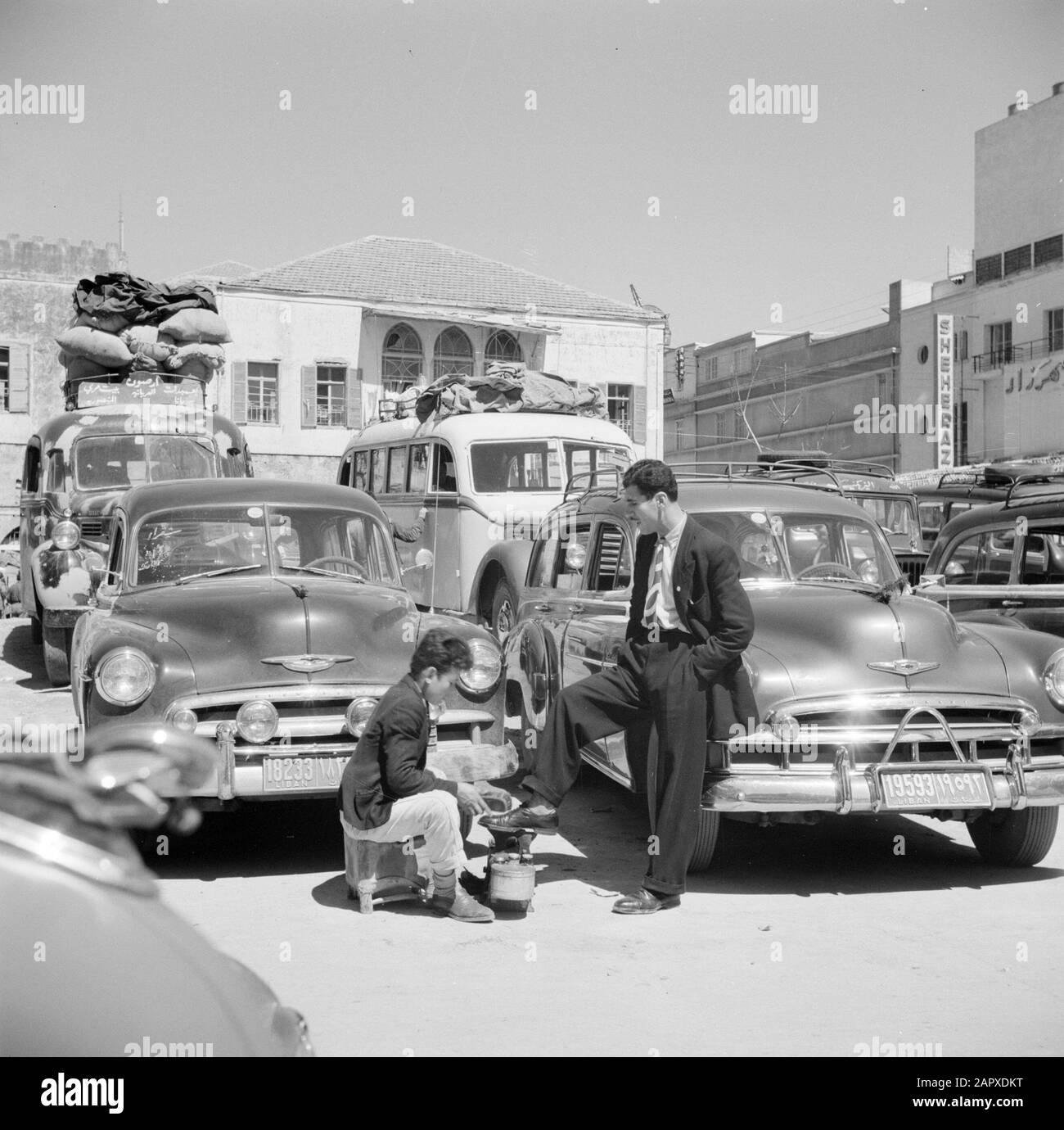 Middle East 1950-1955: Lebanon Shoe Shiner at a bus station in Beirut ...
